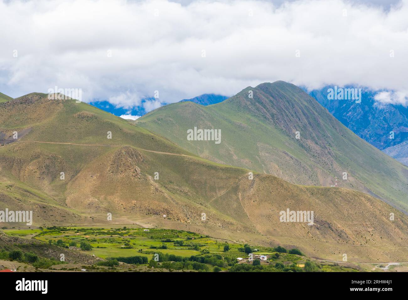 Dark Dramatic Desert Landscape with Foggy Mountains and Distant Houses ...
