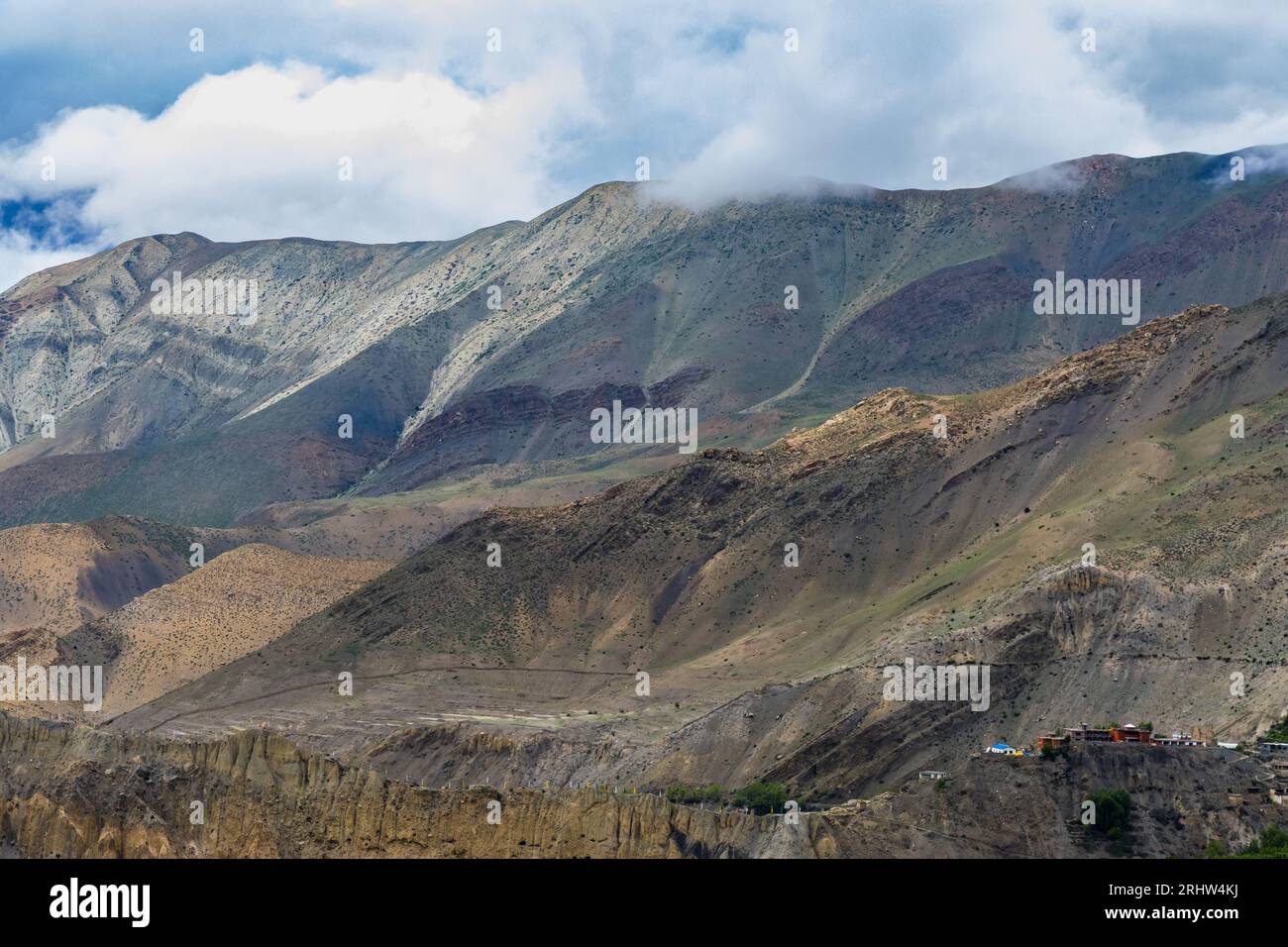 Dark Dramatic Desert Landscape with Foggy Mountains and Distant Houses ...