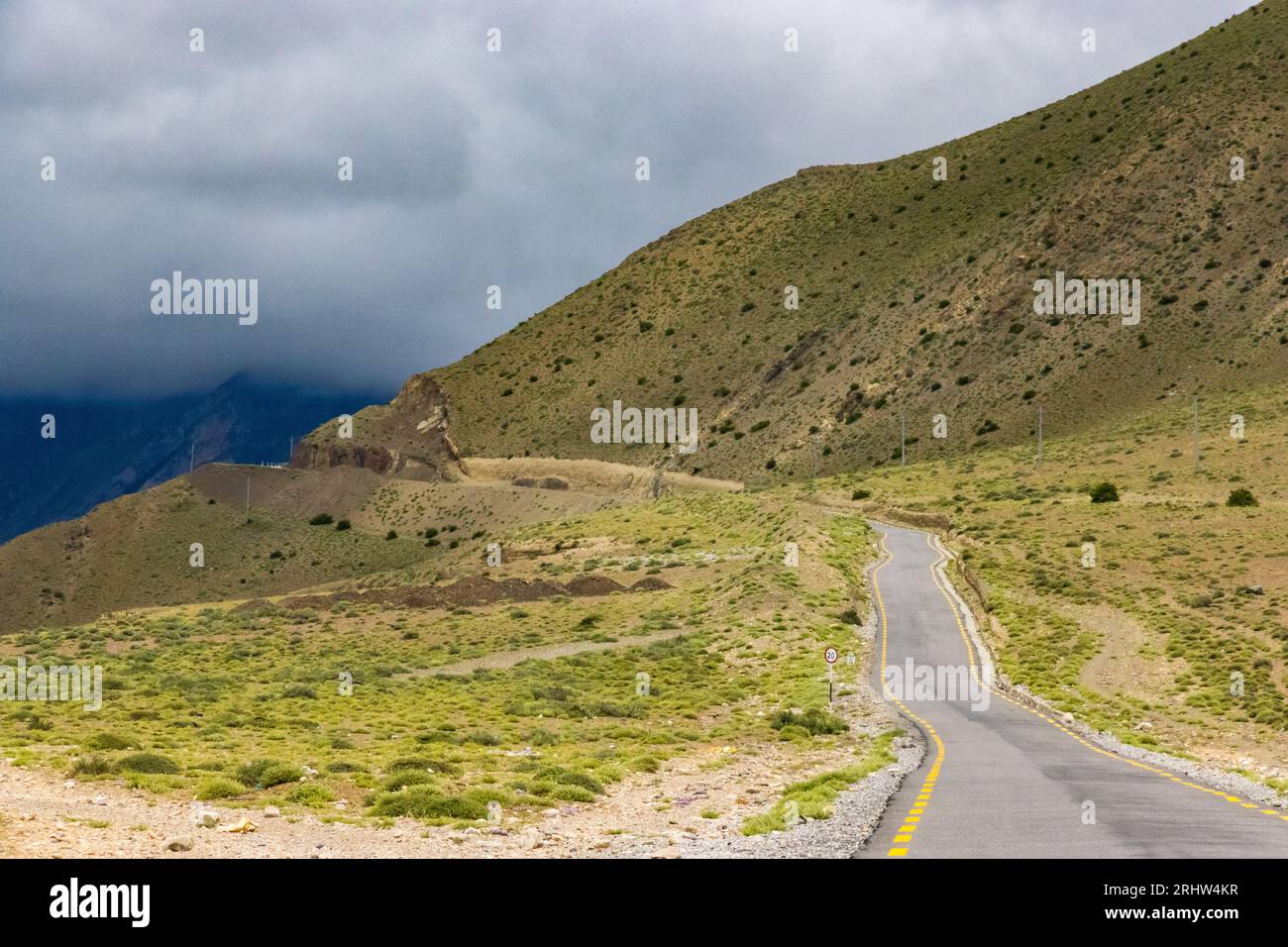 Dark Dramatic Desert Landscape with Foggy Mountains and Distant Houses ...