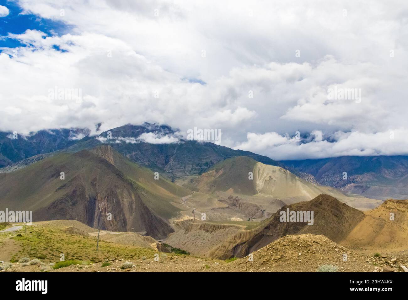 Dark Dramatic Desert Landscape with Foggy Mountains and Distant Houses ...