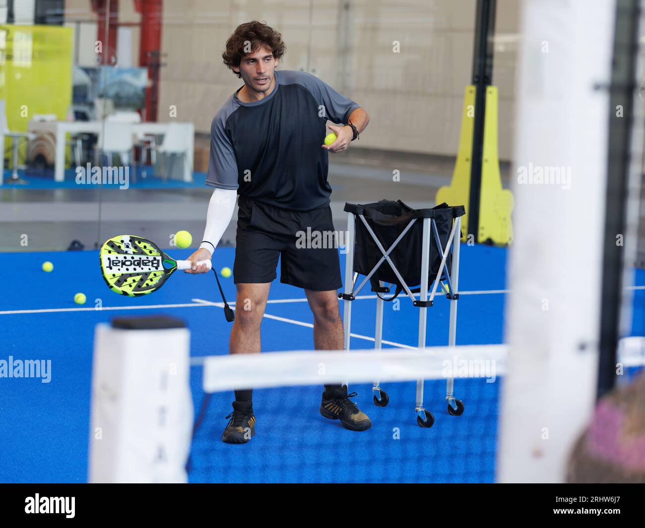 Padel Instructor Teaching the Game Techniques Stock Photo - Alamy