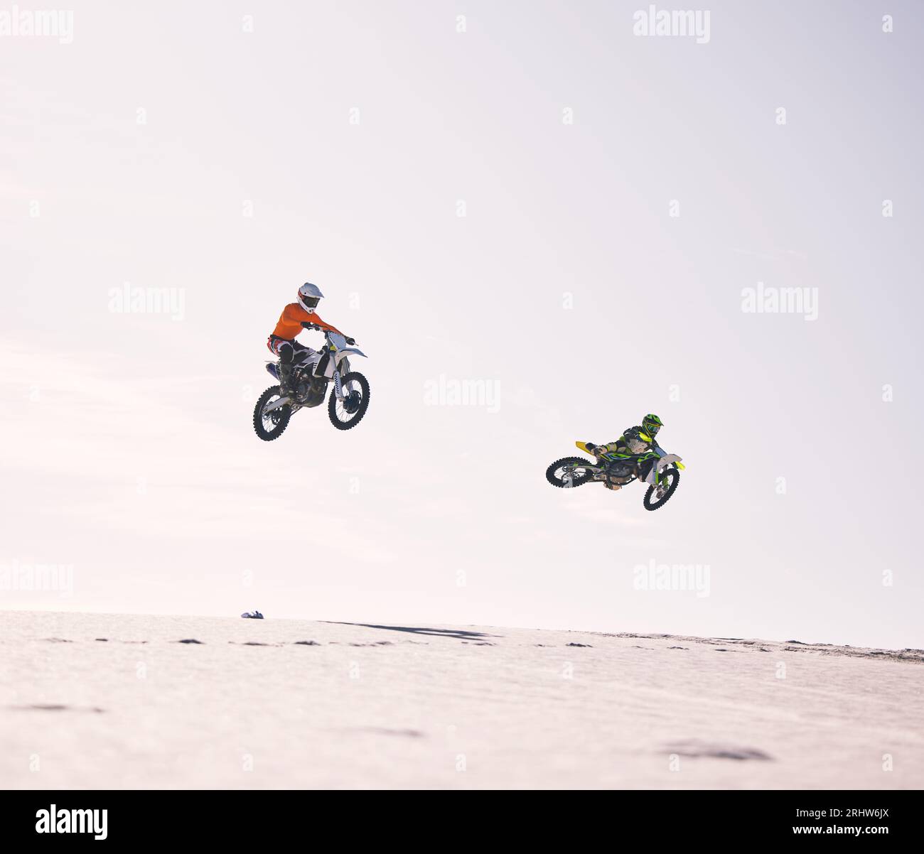 Dune, jump and men on motorbike together for practice, training and ...