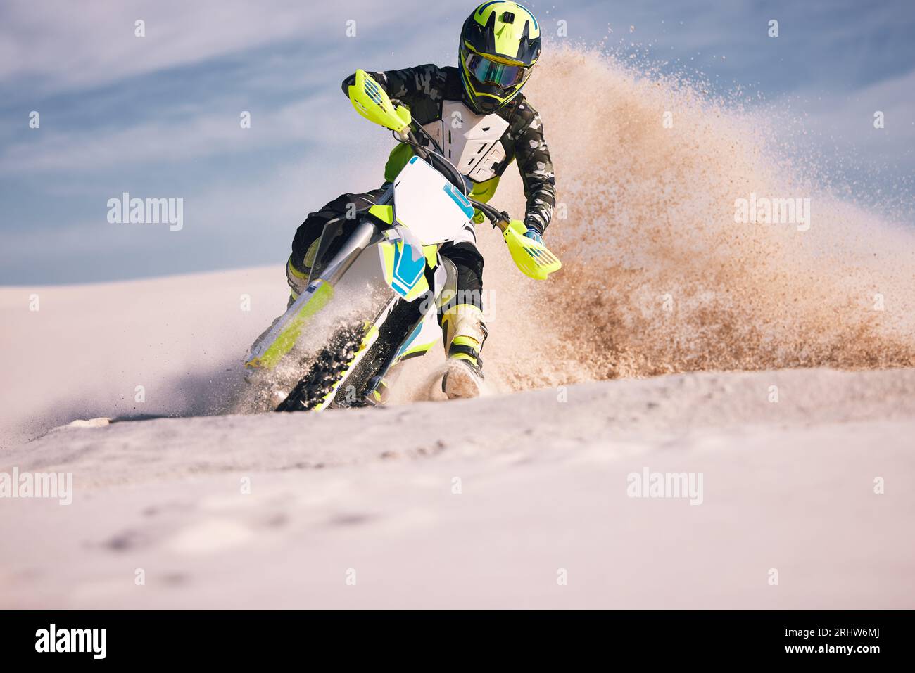 Motorcycle, dust and energy with a sports man riding a vehicle in the ...