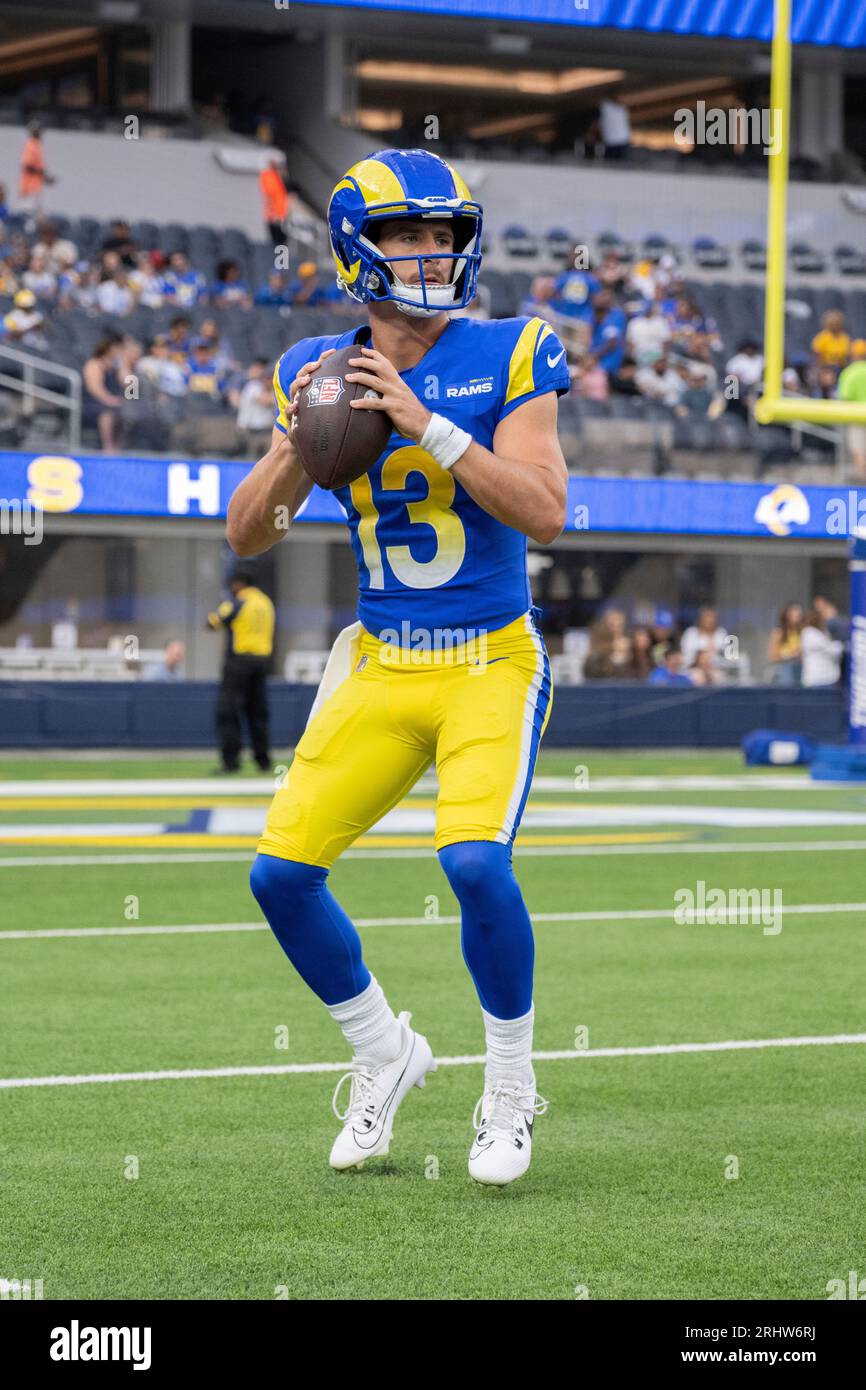 Los Angeles Rams quarterback Stetson Bennett (13) throws a pass before an NFL preseason football ...