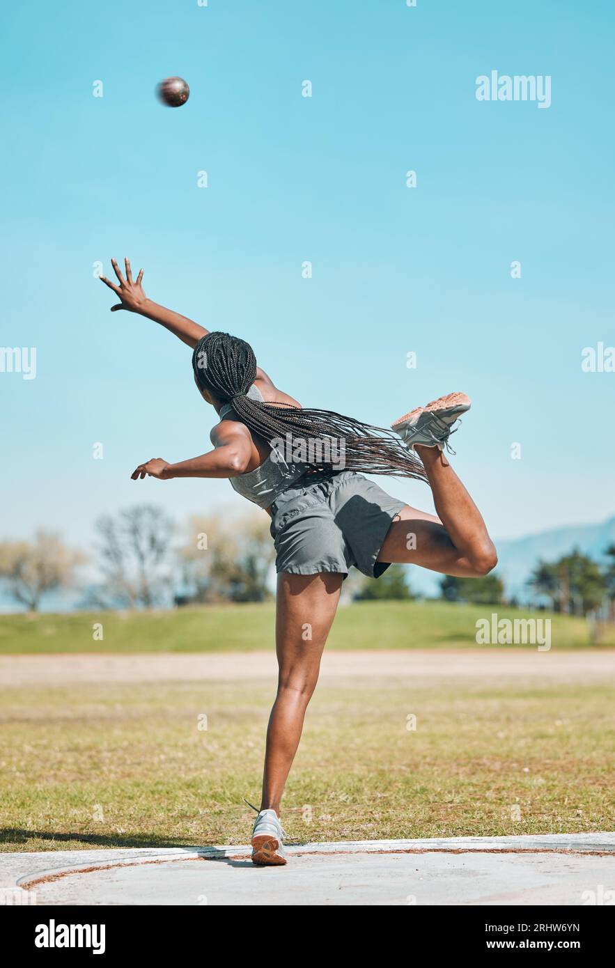 Shot put, woman and athlete throw in competition, challenge or training ...