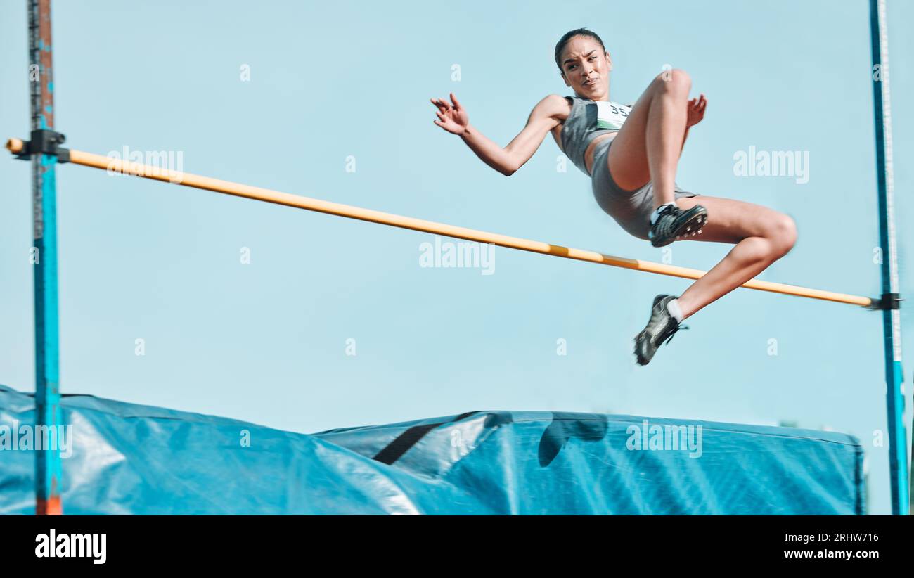 High jump, woman and fitness with exercise, sport and athlete in a ...