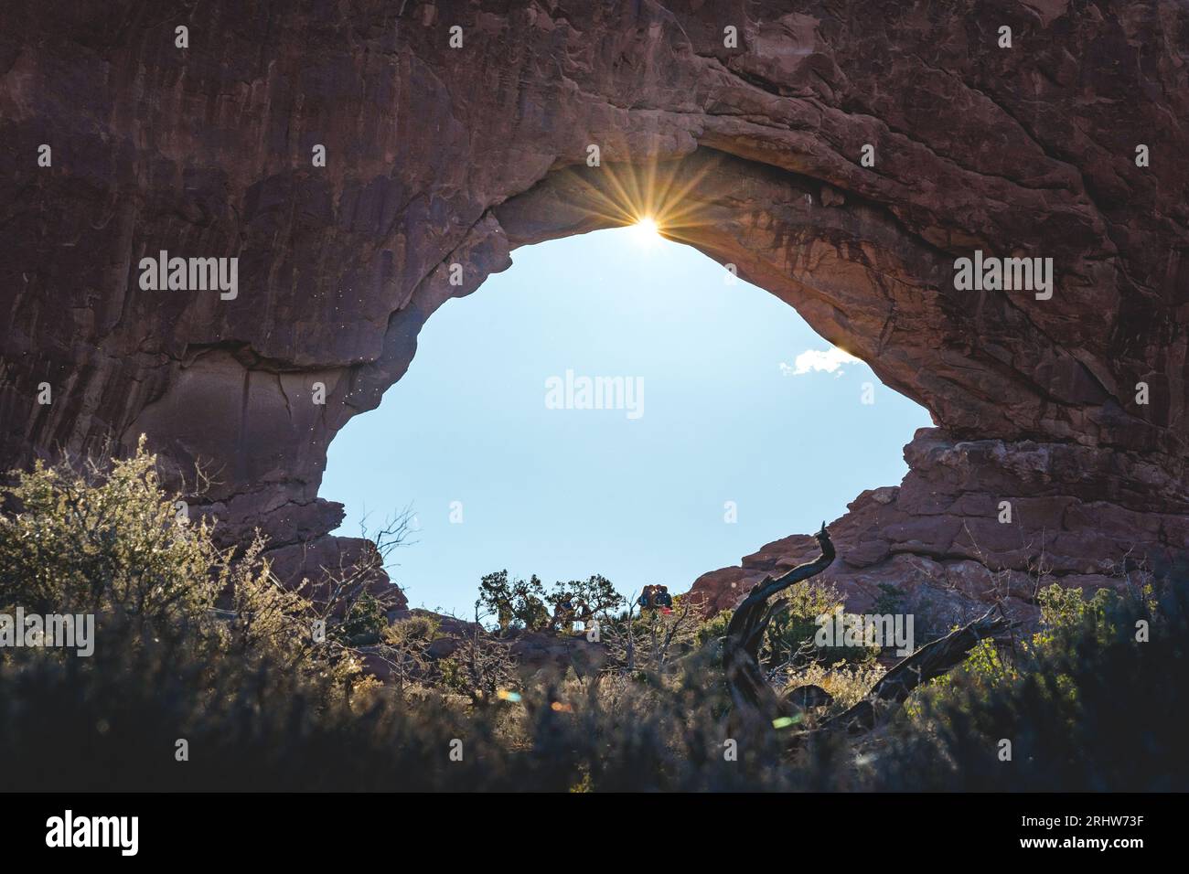sun breaking through window arch in arches nationalpark in utah usa ...