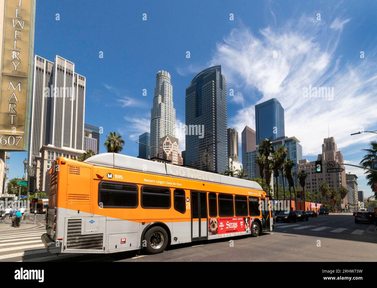 Los angeles Metro clean air city bus in downtown LA with skyscrapers in ...