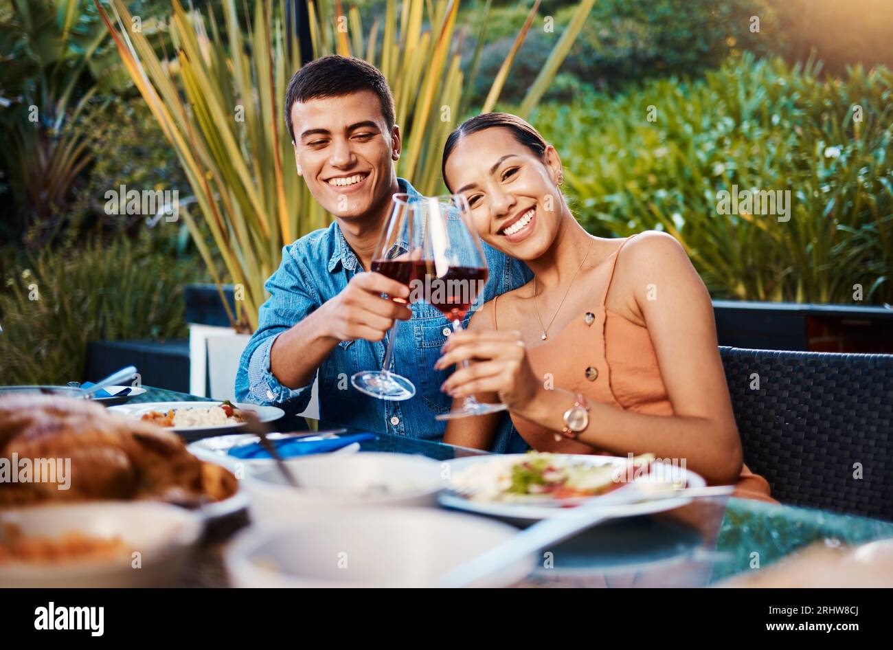Portrait, happy couple and toast with wine glass at restaurant, bonding ...