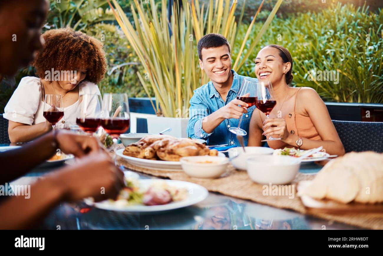 Happy, friends and cheers with wine glass at restaurant, bonding and ...