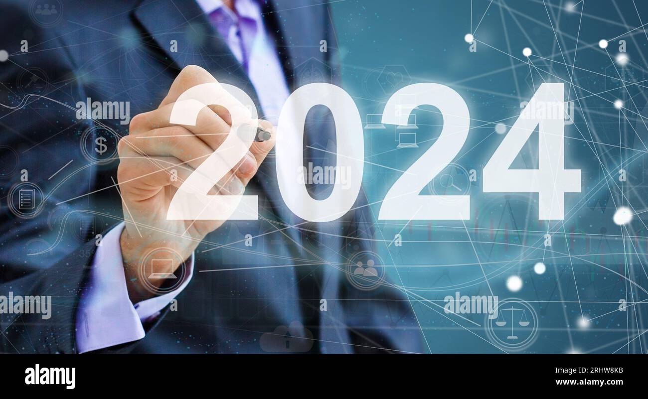 Business man touching screen with 2024 writing Stock Photo - Alamy