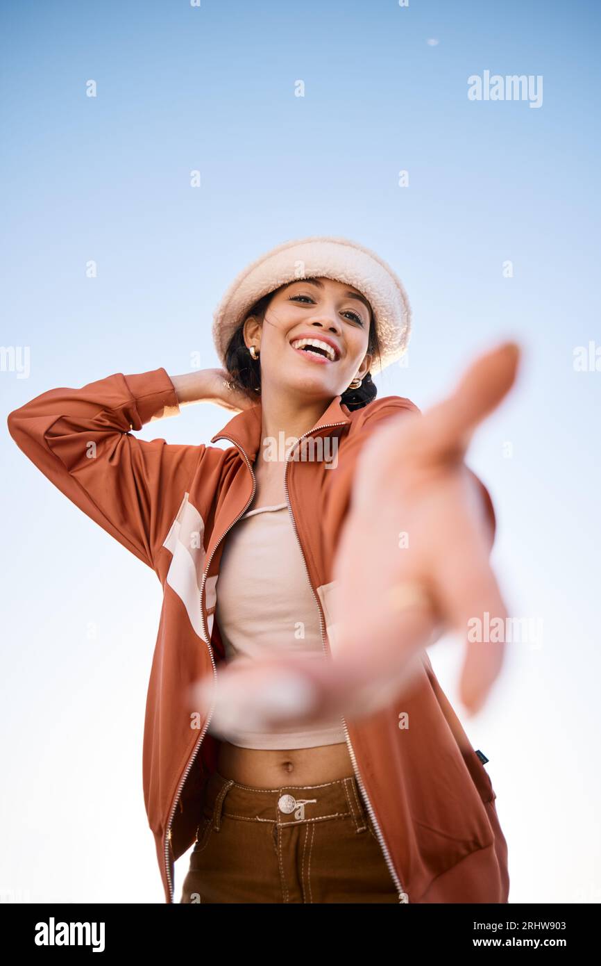 Portrait, woman smile and offer helping hand to welcome outdoor on low ...
