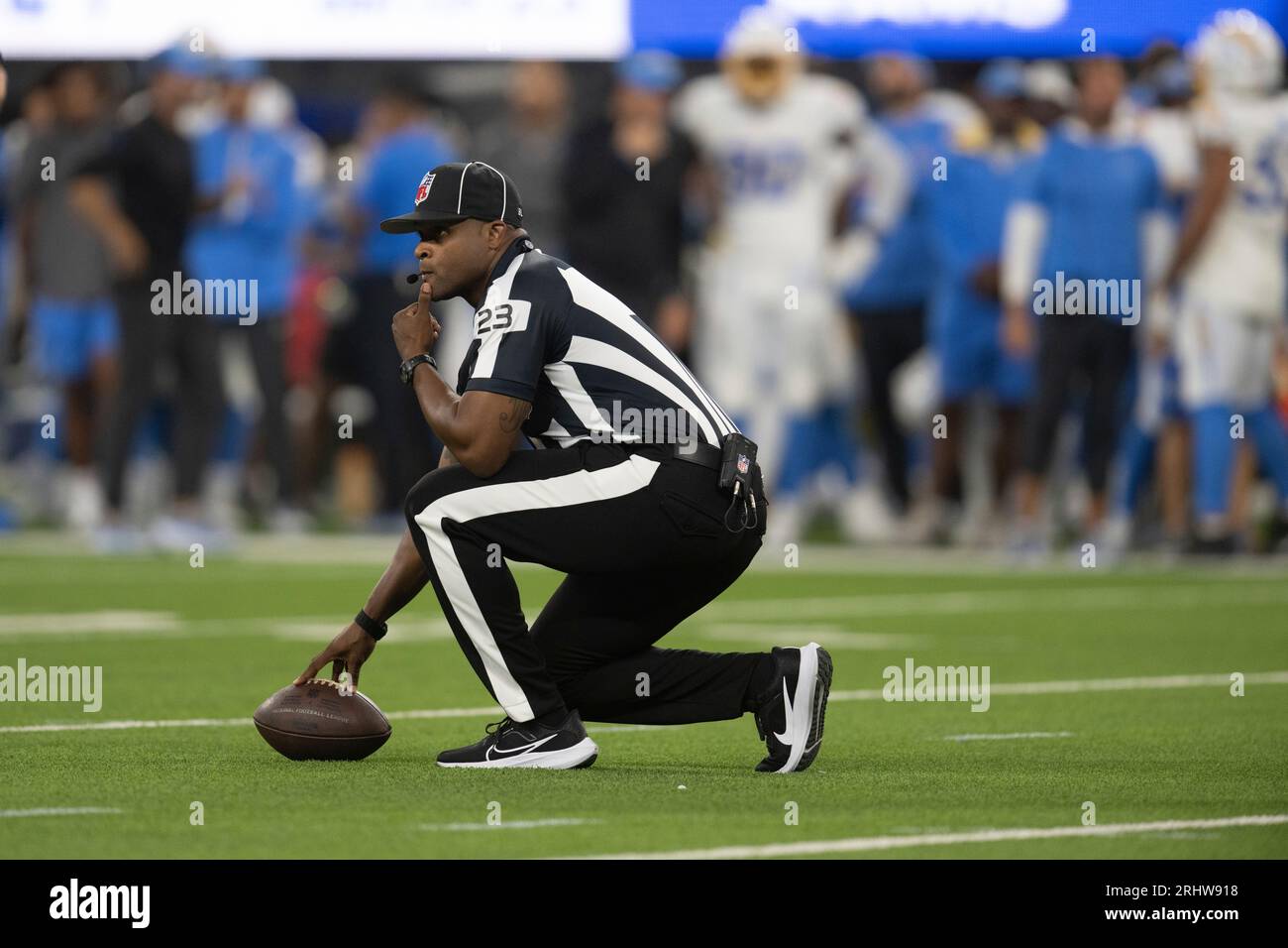 Field judge Tra Boger (23) measures the ball during an NFL preseason ...