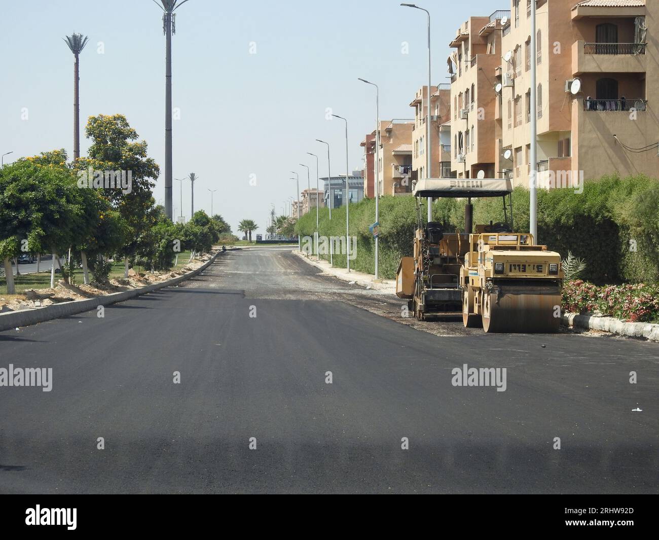 Cairo, Egypt, July 21 2023: the process of paving a road and making ...