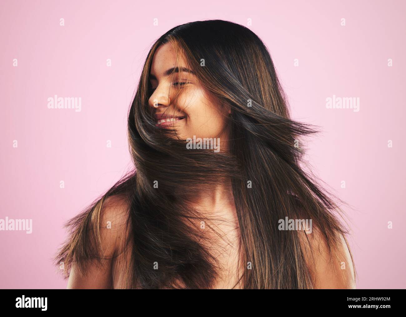 Hair care, smile and woman shaking head in studio, luxury salon ...