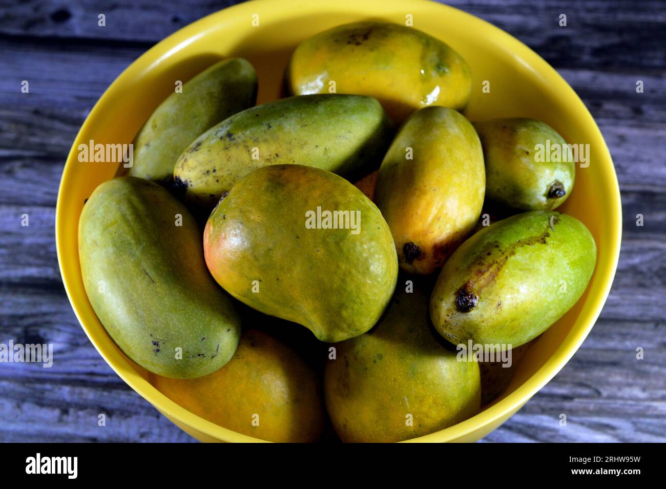 Bowl contains Egyptian fresh mango fruit with tropical delicacy ...