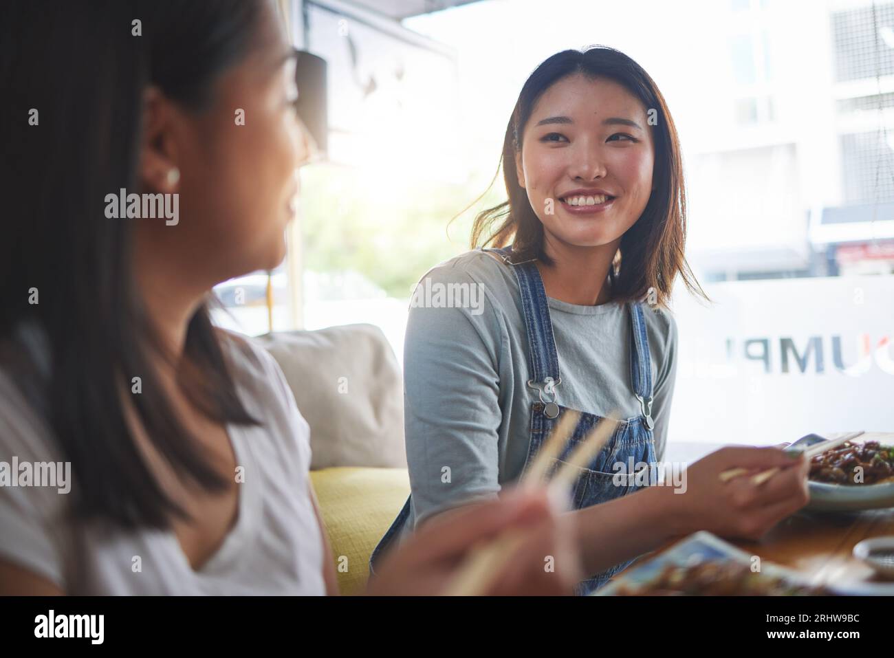 Restaurant, girl friends and lunch with food, noodles and cafe happy ...
