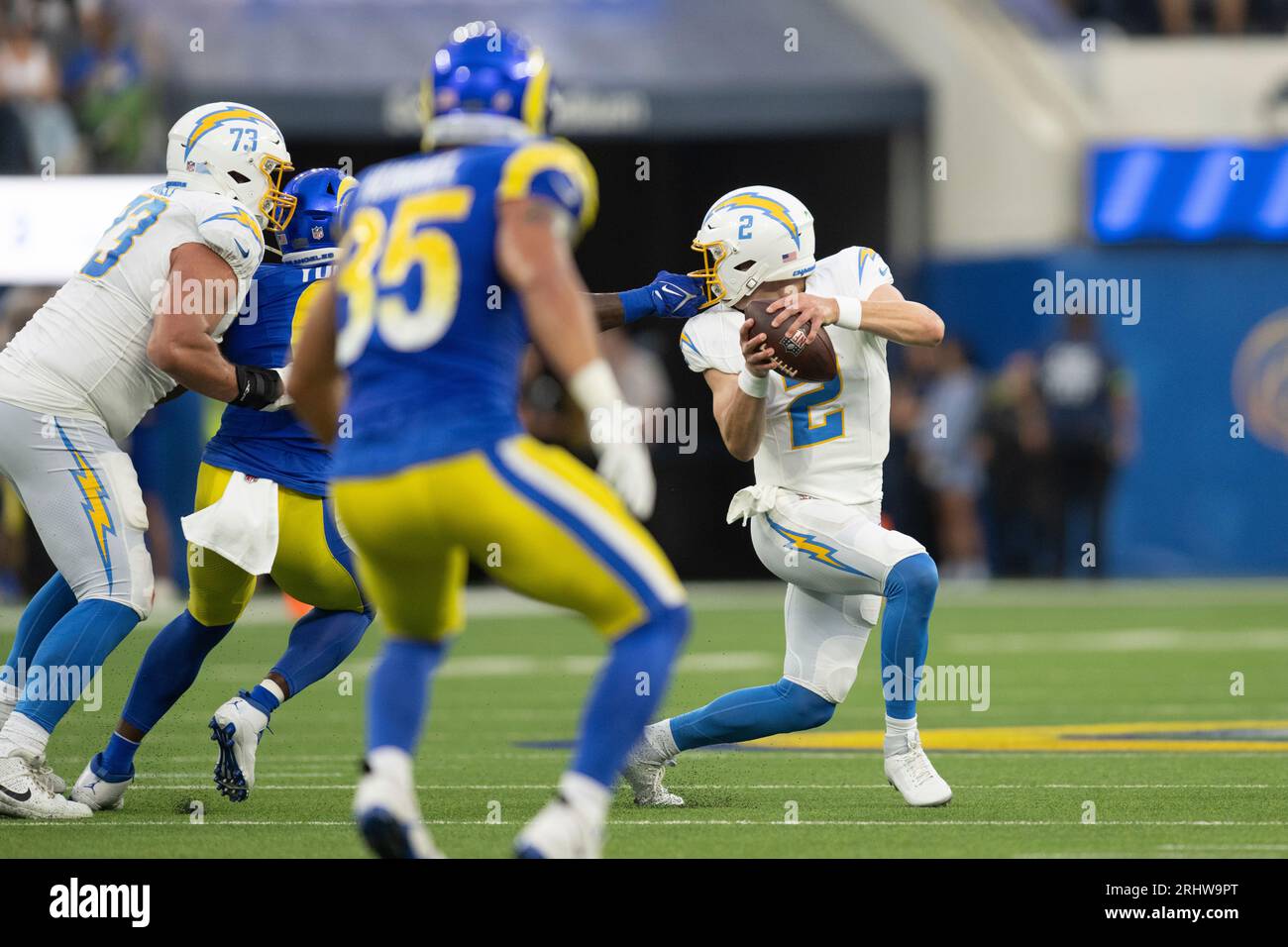 Los Angeles Chargers quarterback Easton Stick (2) gets his face mask ...