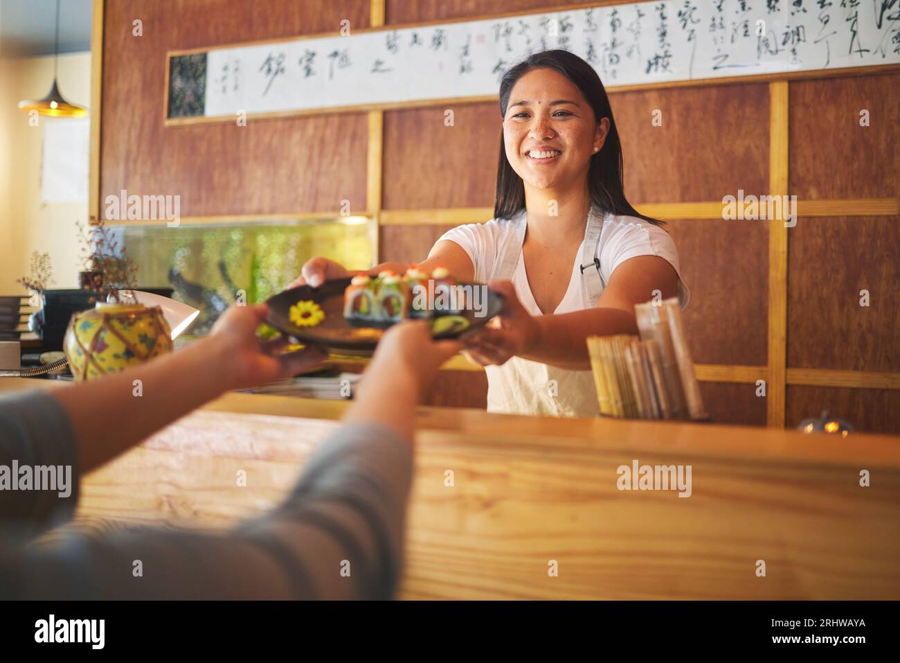 Sushi chef, restaurant worker and woman with smile from food and Asian ...
