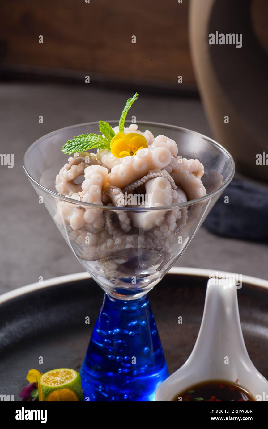 boiled mini octopus and sauce Stock Photo - Alamy