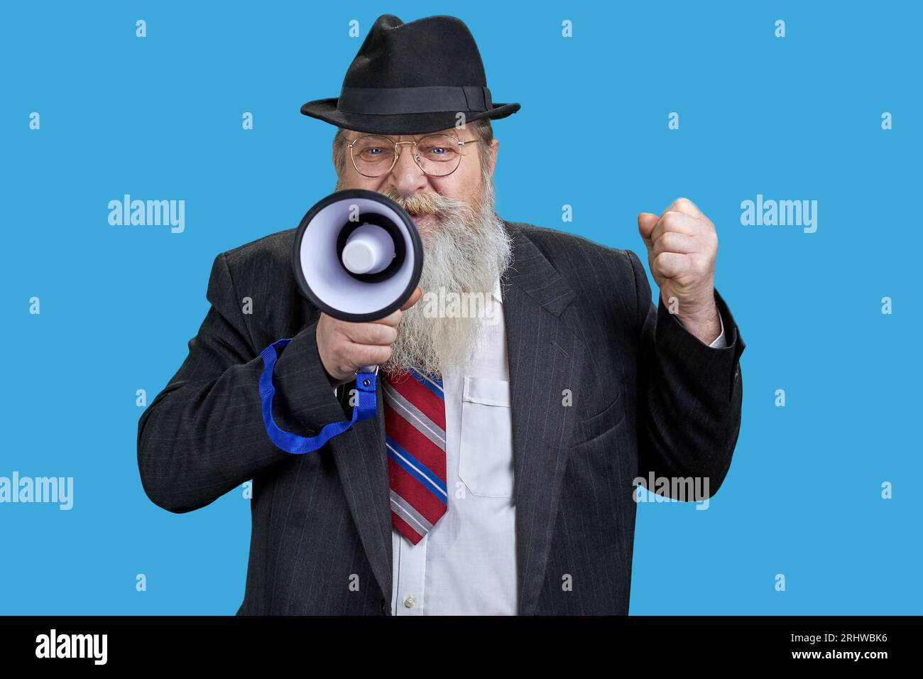 Portrait of charismatic old man giving a speech in megaphone. Isolated ...