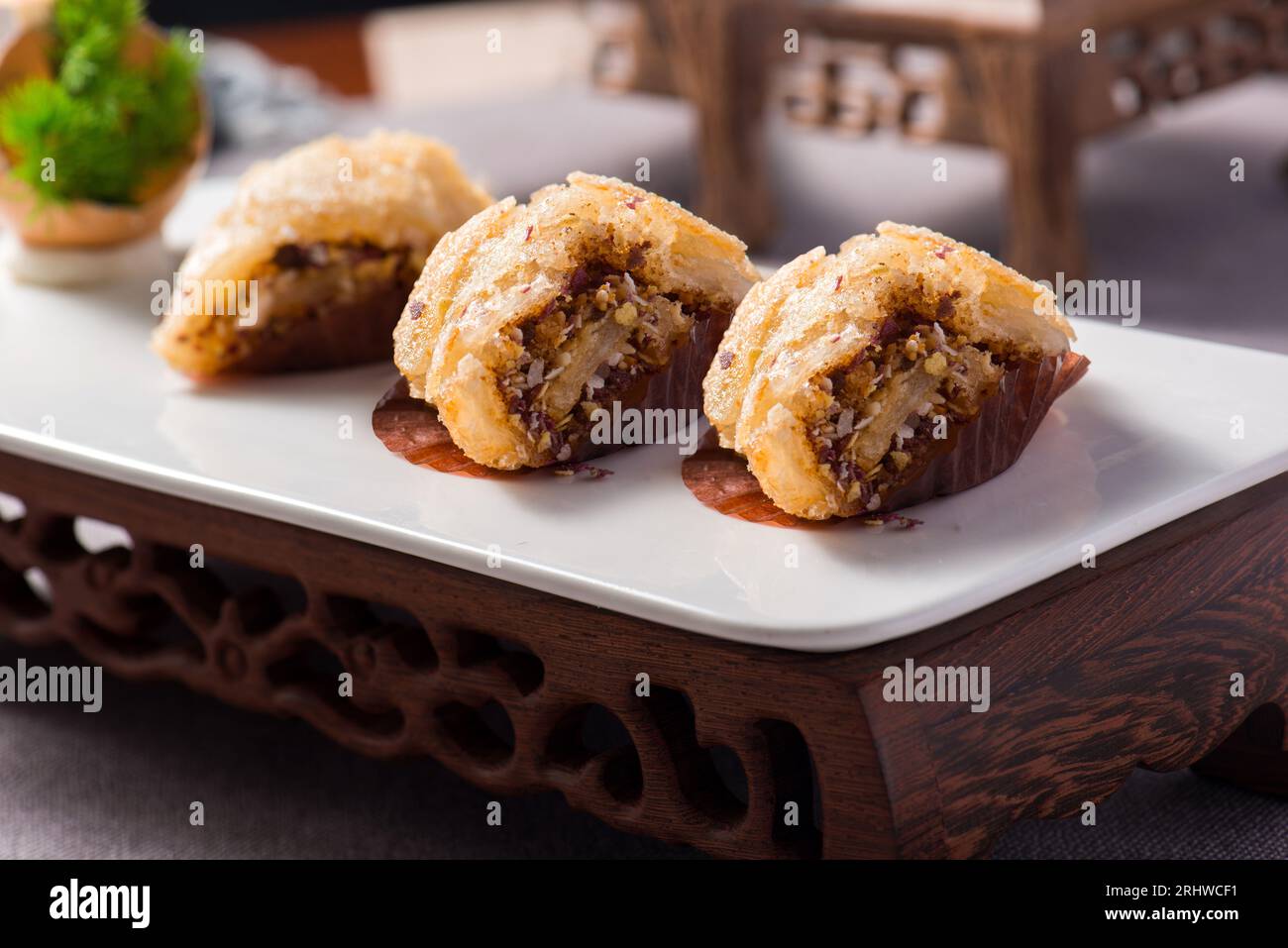 A plate of traditional Sichuan snacks, Brown sugar glutinous rice cake ...