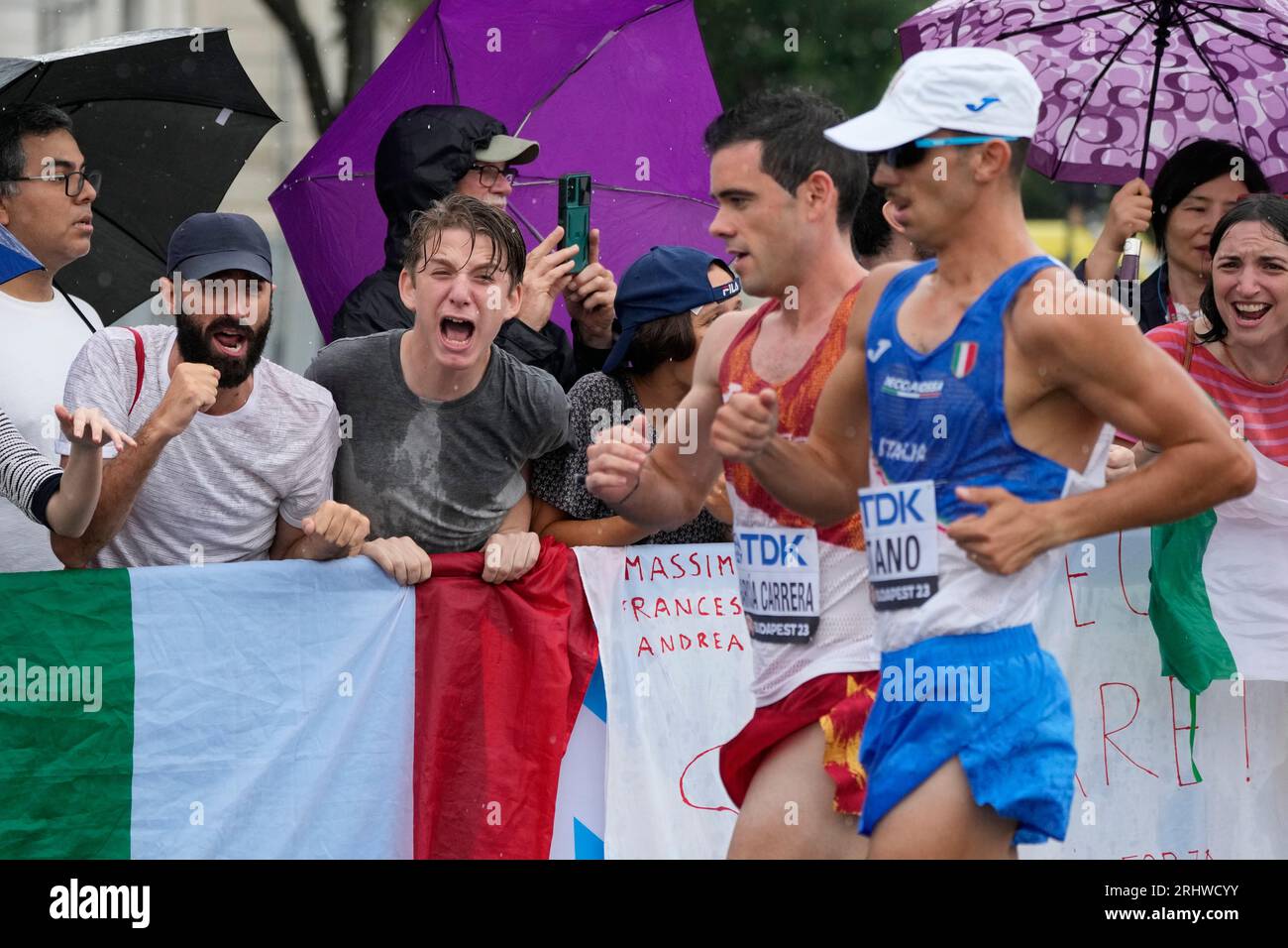Supporters of Francesco Fortunato, of Italy, right, shout out as he ...