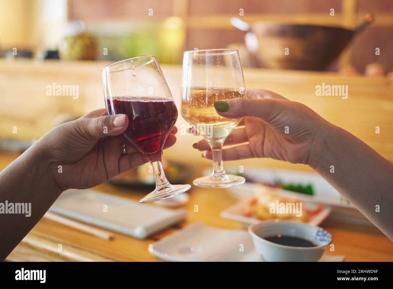 Hands, wine glass and friends toast in restaurant in celebration ...