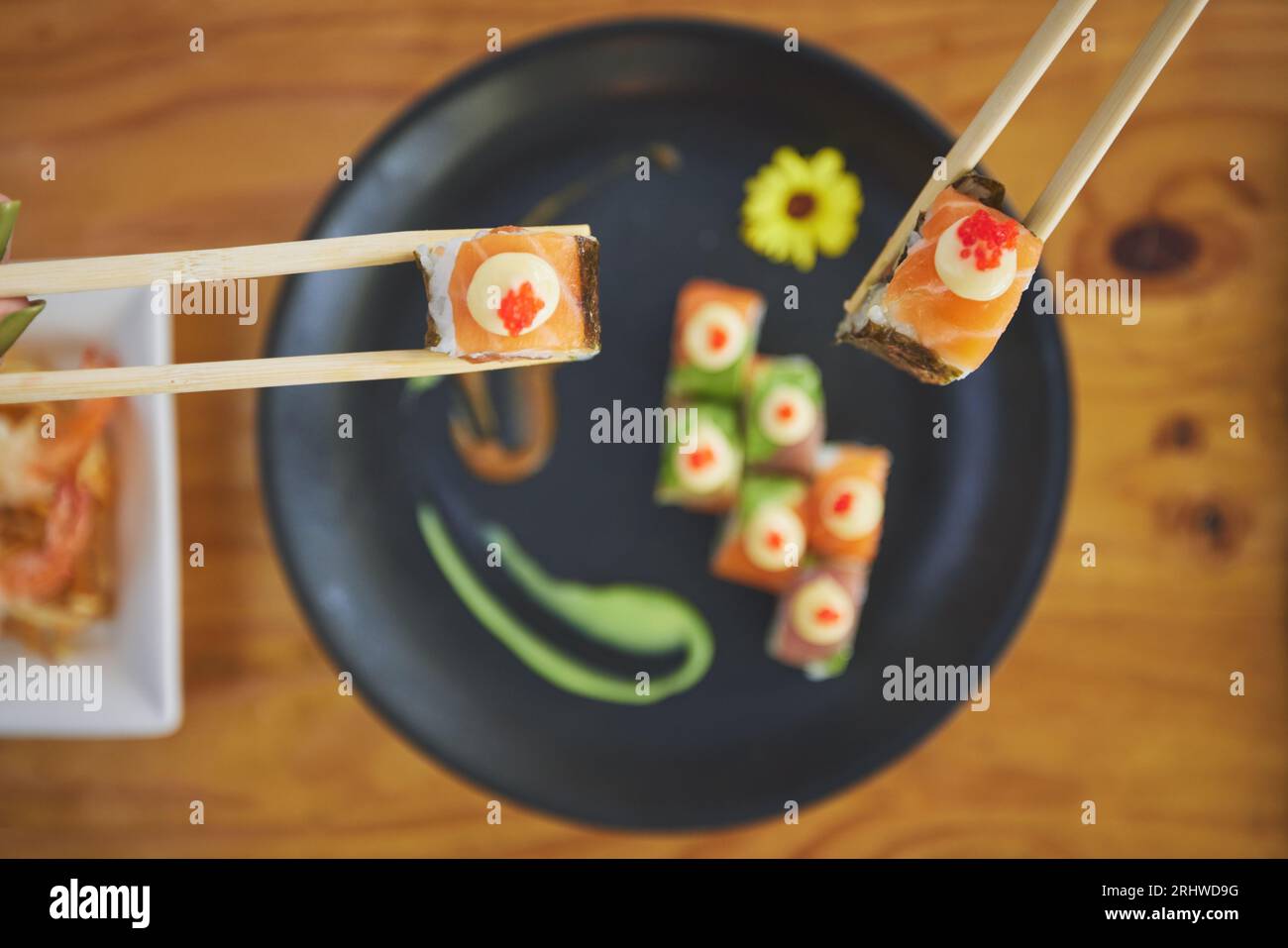 Sushi, seafood and chopsticks in a chinese restaurant from above for ...