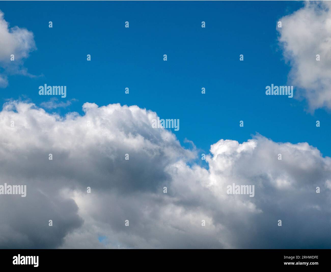 White single clouds over blue sky background. Fluffy cumulus clouds ...