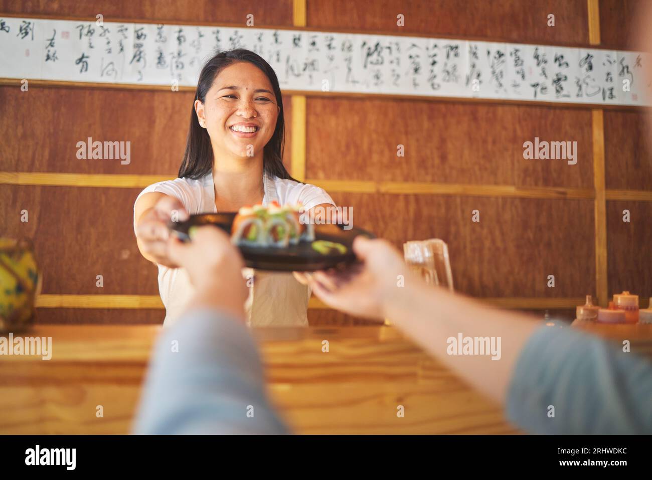 Sushi, restaurant worker job and woman with smile from food and Asian ...