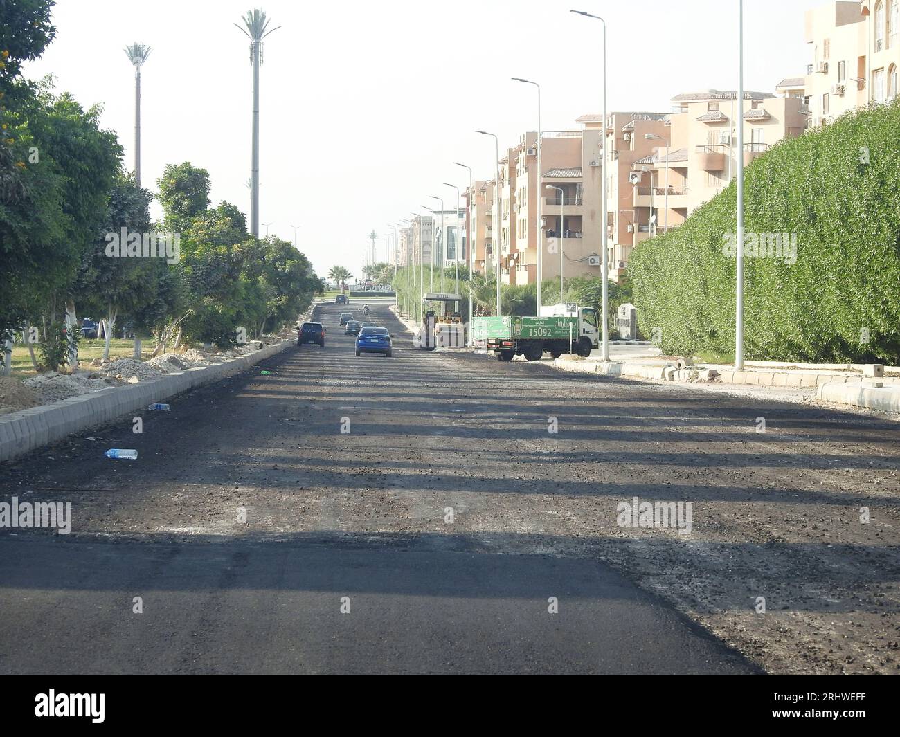 Cairo, Egypt, July 19 2023: the process of paving a road and making ...