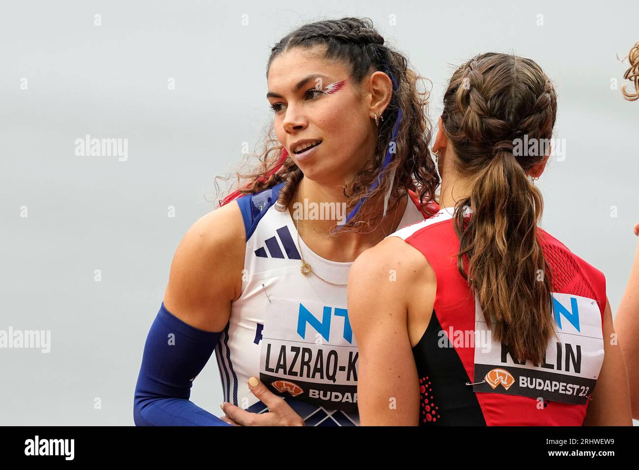 Auriana Lazraq-Khlass, of France, left, reacts as she crosses the ...