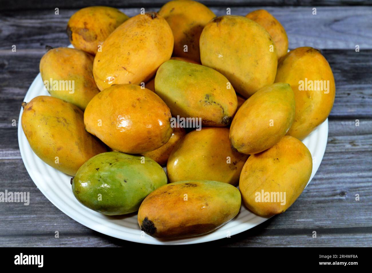 Plate of Egyptian fresh mango fruit with tropical delicacy, mangoes are ...