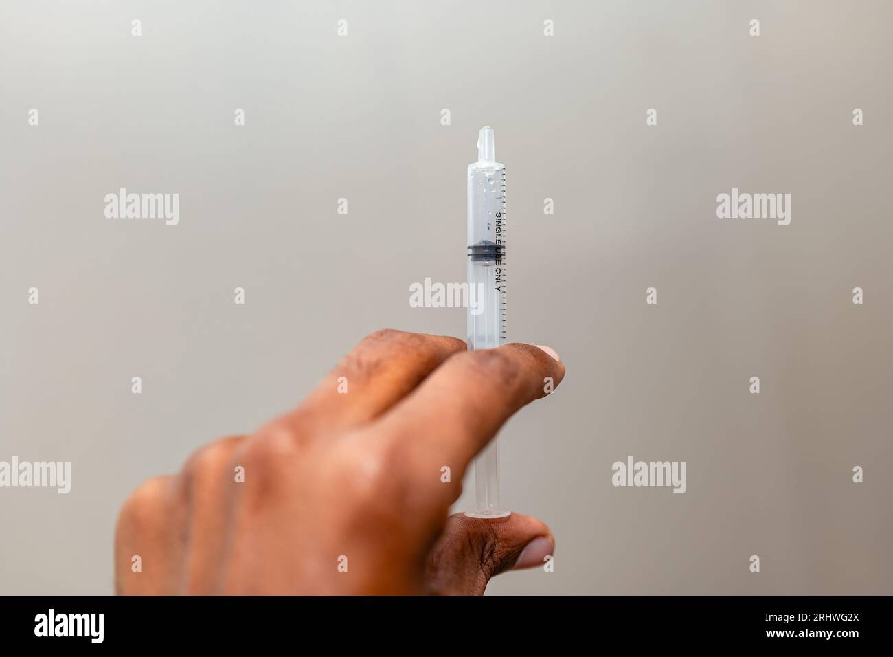 Hand giving painkiller injection hi-res stock photography and images ...
