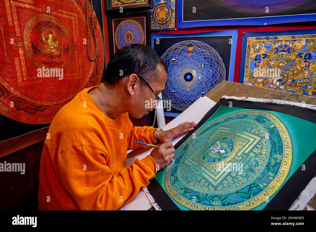 Nepal, Kathmandu valley, Bhaktapur city, artist painting a mandala ...