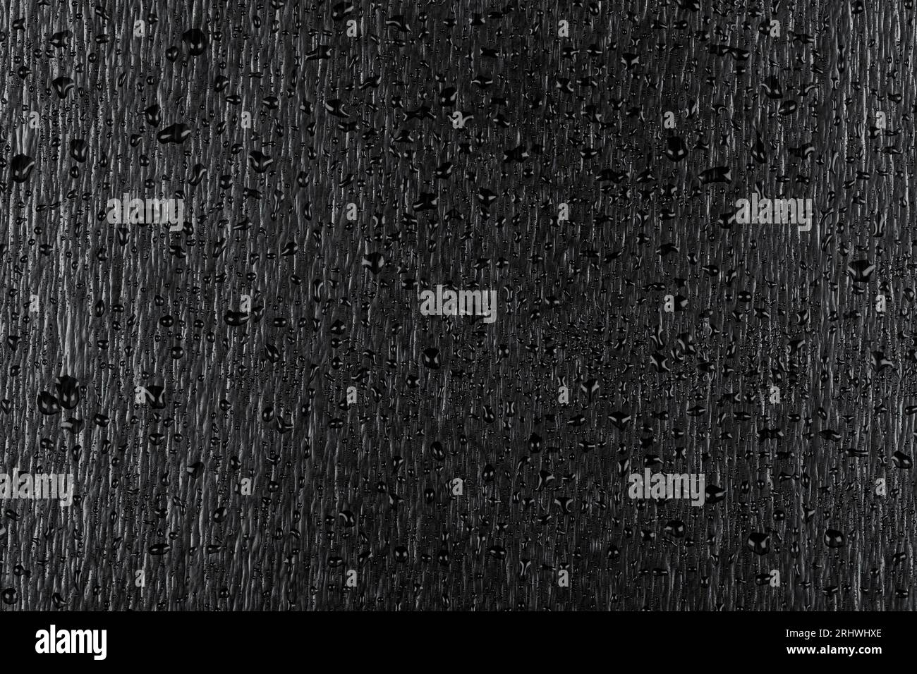 Water drops on dark stone surface texture background Stock Photo - Alamy