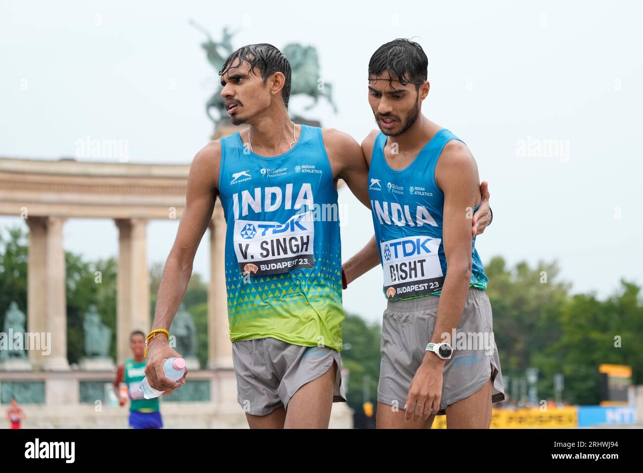 Vikash Singh, of India, left and Paramjeet Singh Bisht, of India, hug ...