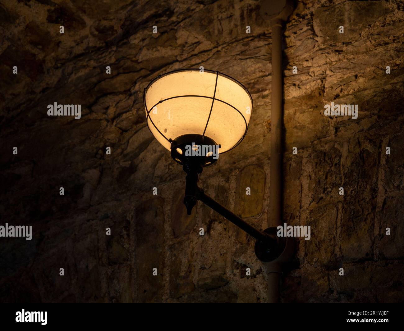 Old ancient lamp on the wall of a prison background, gloomy light Stock ...