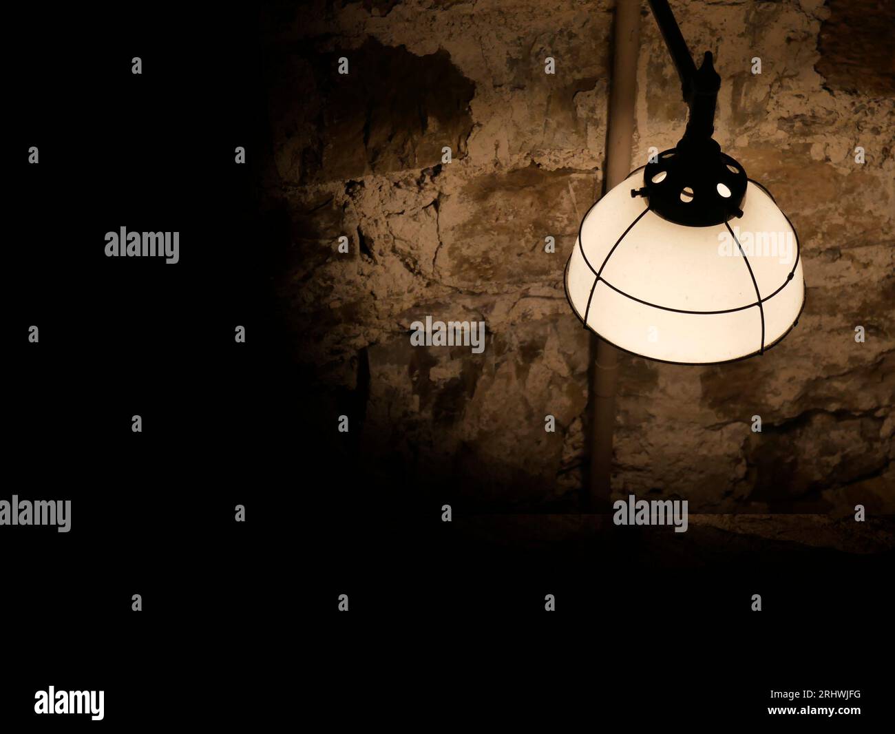 Old ancient lamp on the wall of a prison background, gloomy light Stock ...