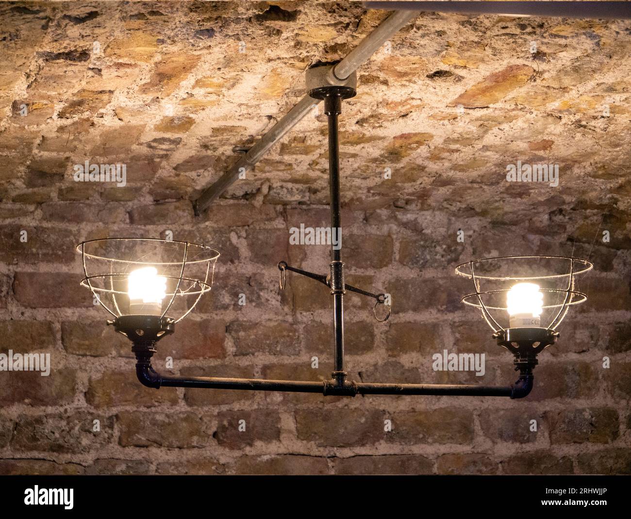 Old ancient lamps on the wall in a dark room background, gloomy light ...