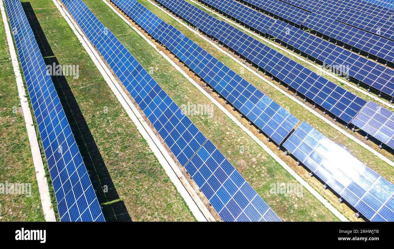 Outdoor solar power plant on a field. Green energy Stock Photo - Alamy