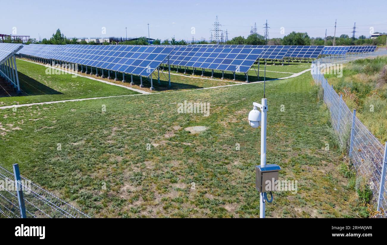 A surveillance camera at a solar power plant. Green energy Stock Photo ...