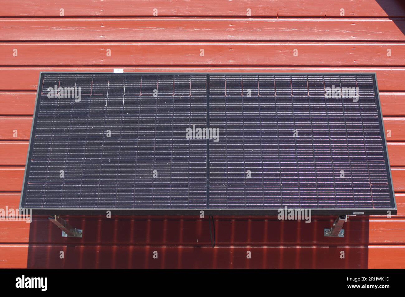 Photovoltaic panels mounted on a house wall in the sun Stock Photo - Alamy