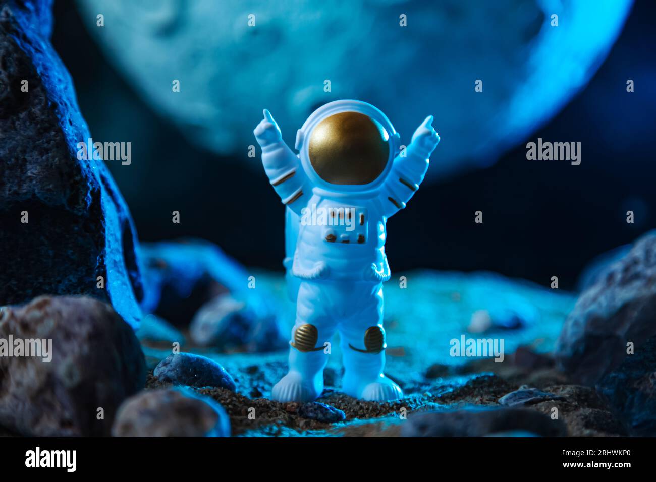 Astronaut in a space suit raised his hands in a sign of welcome on ...