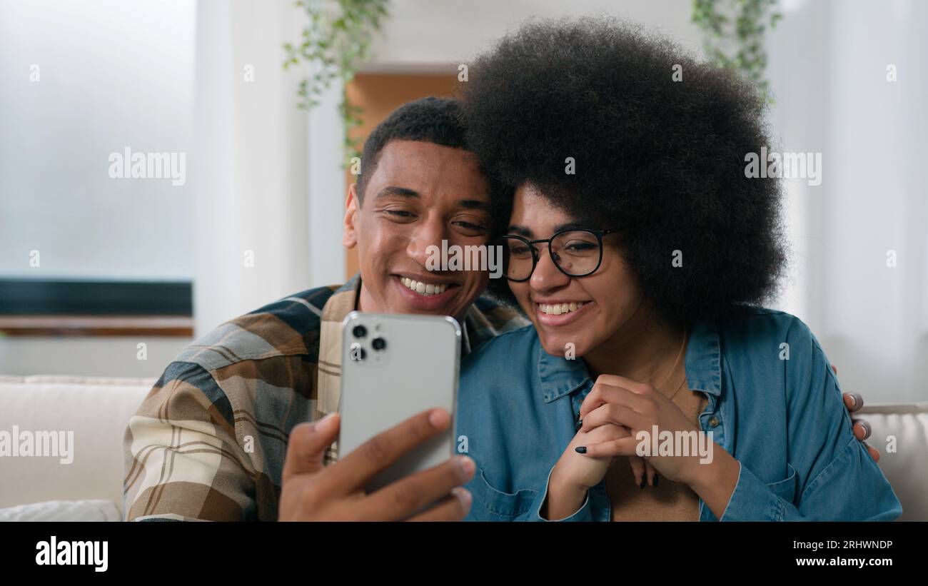 African American happy couple family laughing talking pleasant ...