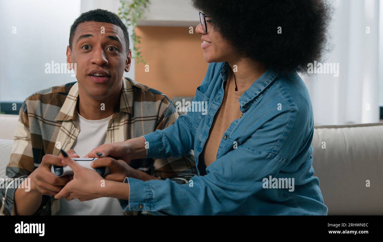 African American family at home couch man guy boyfriend playing video ...