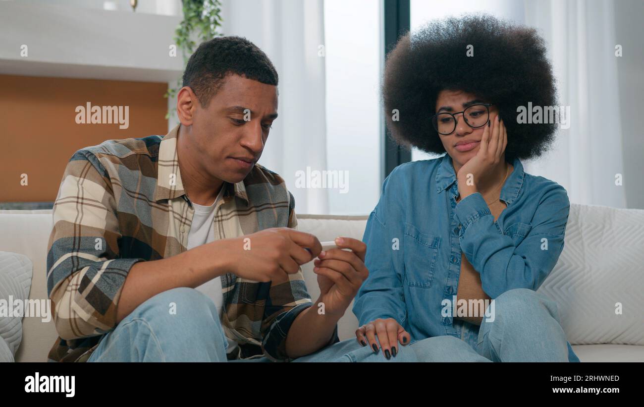 Couple African American man sad woman upset worried anxious family with ...