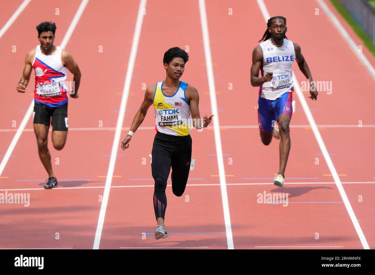 Muhd Azeem Fahmi, of Malaysia, center, crosses the line to win a Men's ...