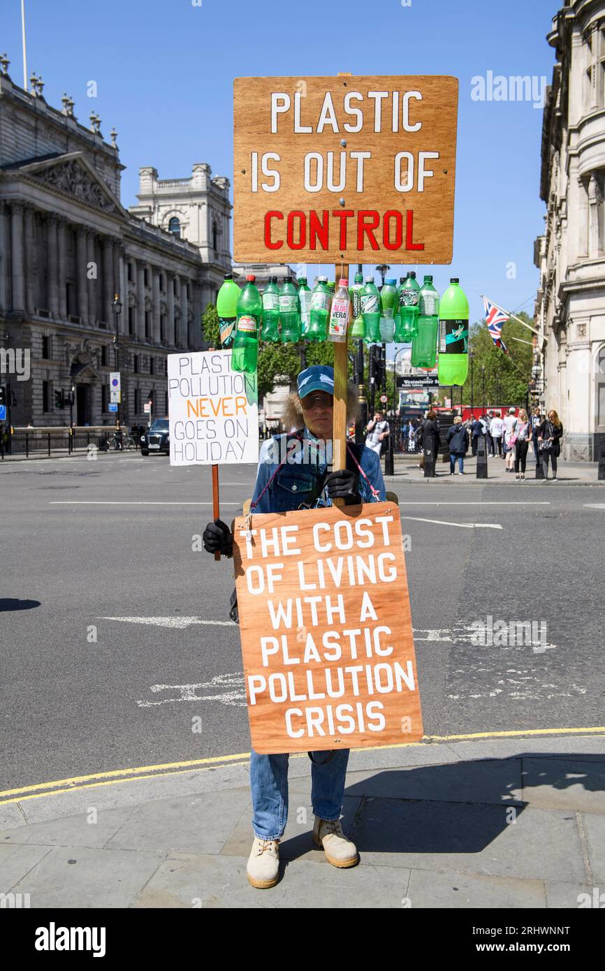 An environmental protester demonstrating against the use of plastic ...